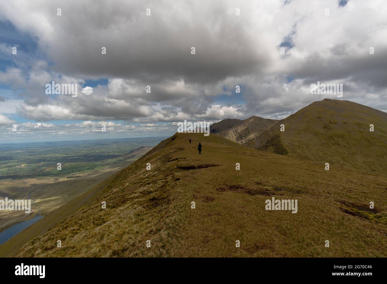 Beautiful landscape with high mountains under the cloudy sky in Kerry ...