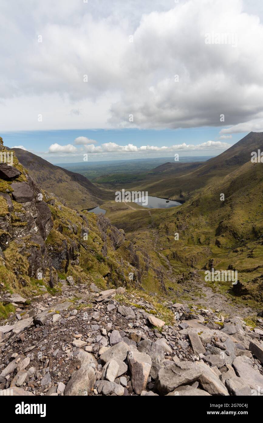 Beautiful landscape with a path leads to the Dunloe mountains of Kerry ...