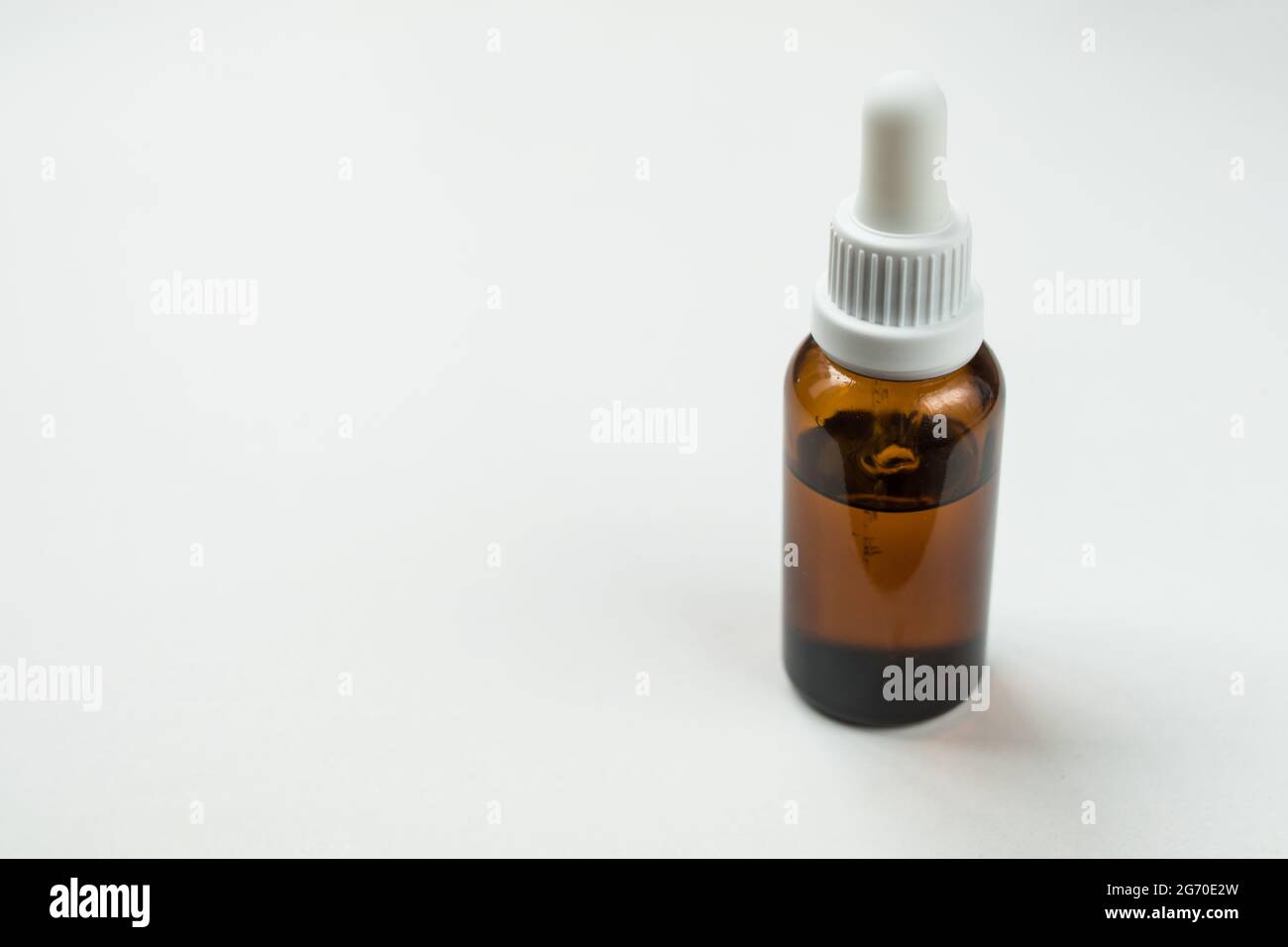 Glass brown dropper with a white background with copy space Stock Photo ...