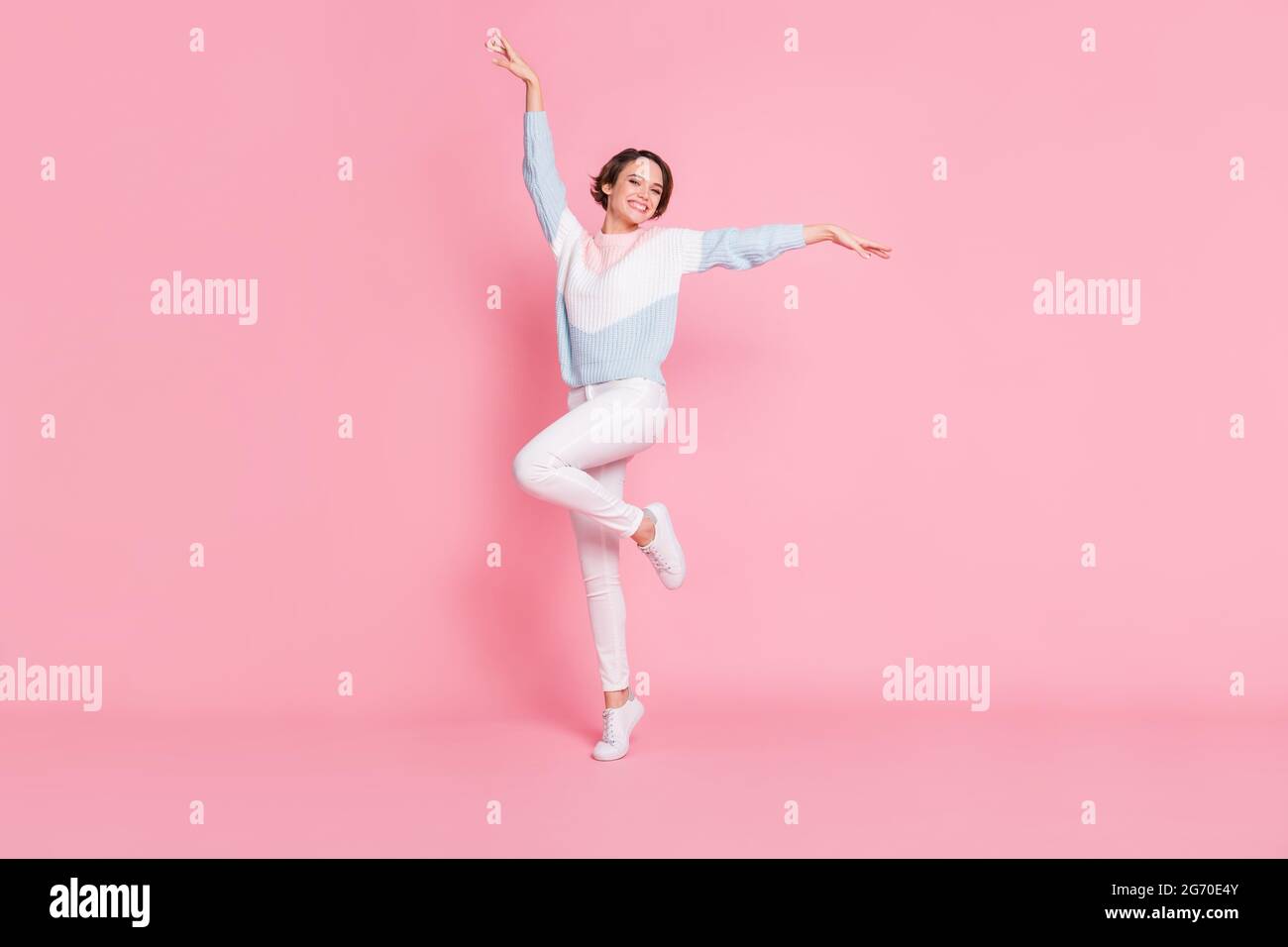 Photo portrait full body view of cute girl standing on one leg dancing ...