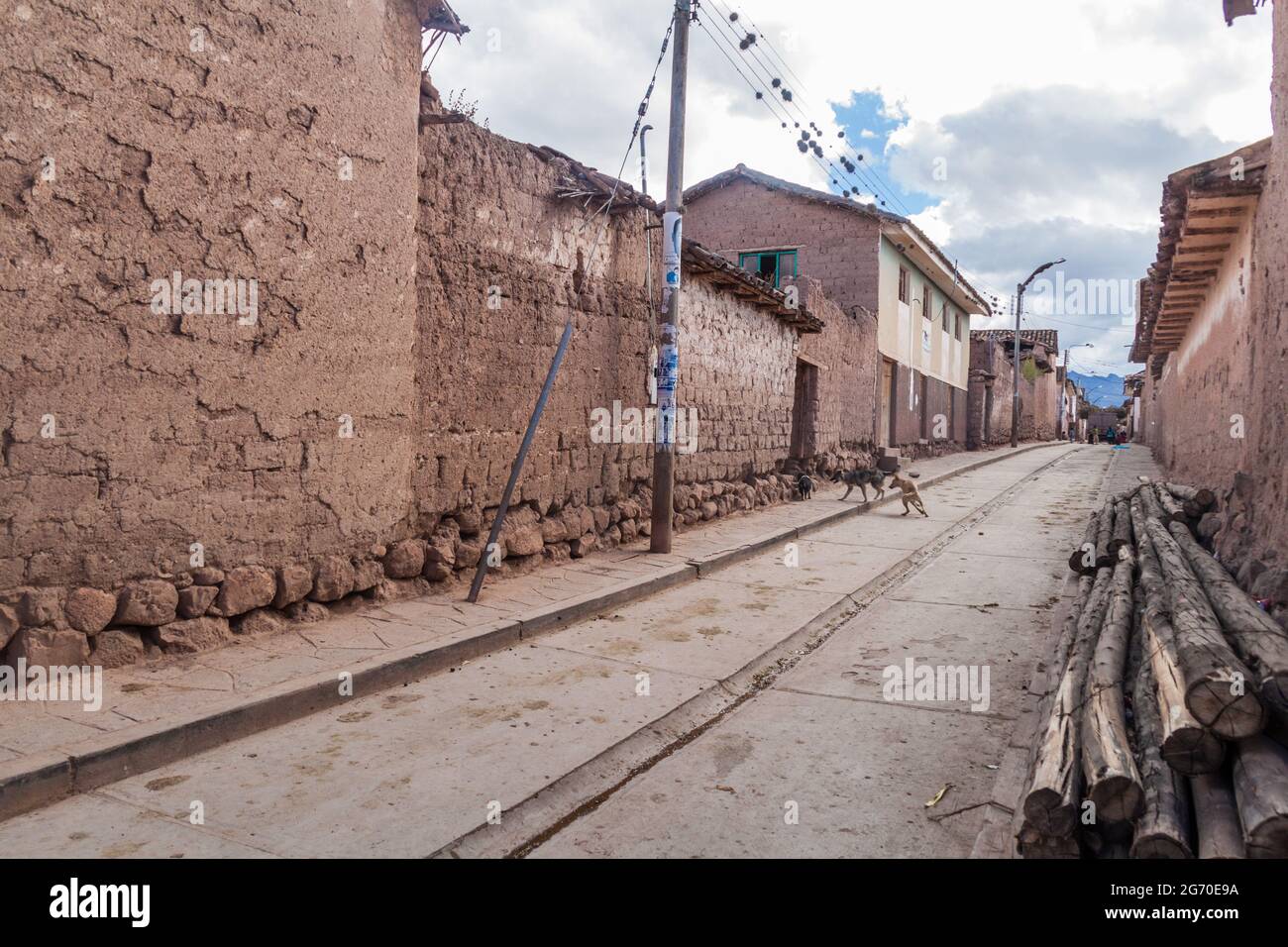 Street with traditional adobe houses in Maras village, Peru Stock Photo ...
