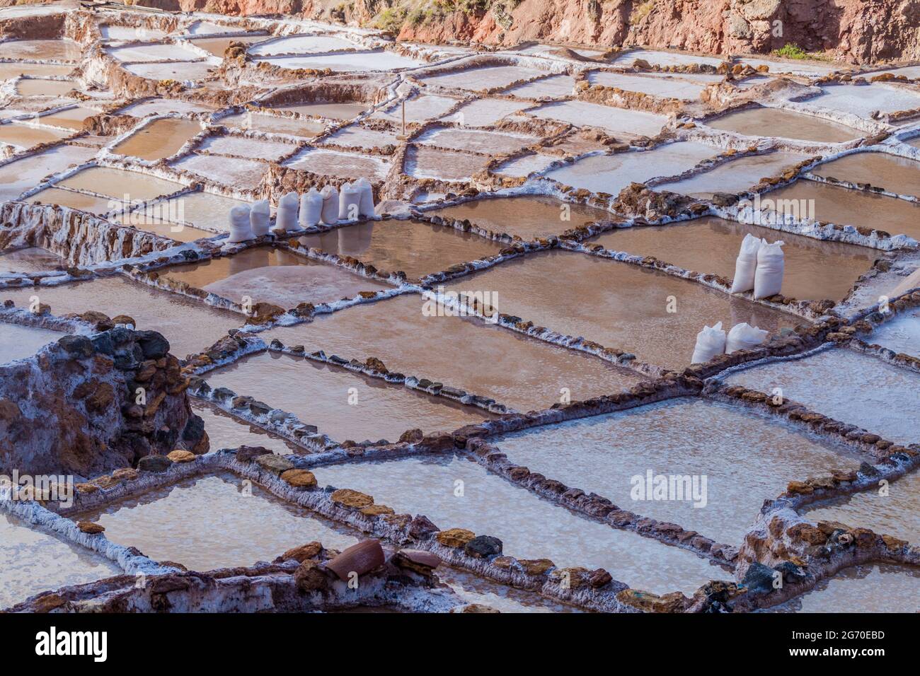 Bags of salt at salt extraction pans (Salinas) in Sacred Valley of ...