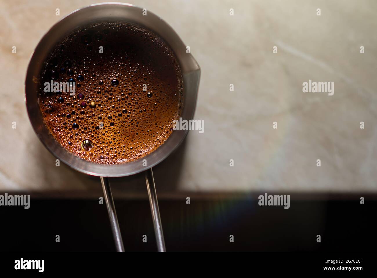 ready-made turkish coffee in a cezva in a turk on the table top view ...