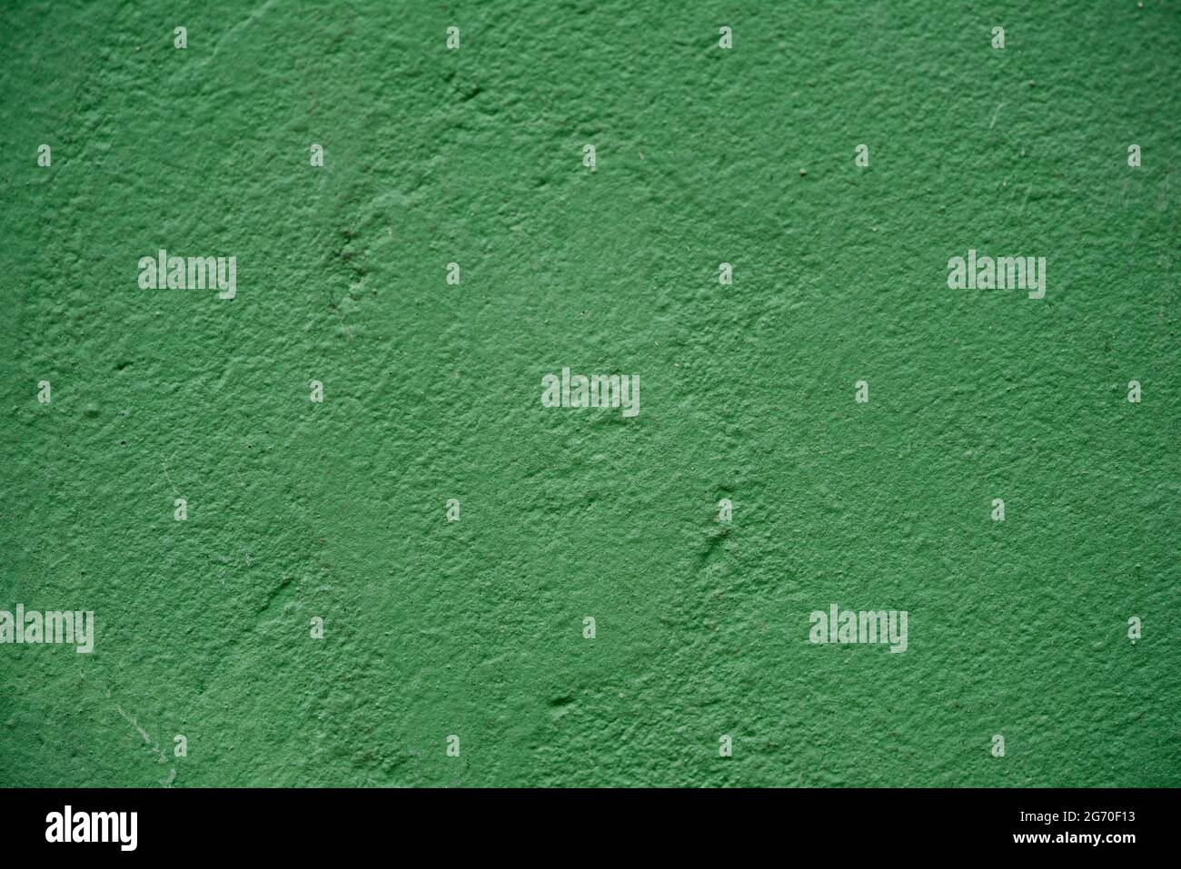 Grain green dribbled paint wall background or texture. Wide Background ...