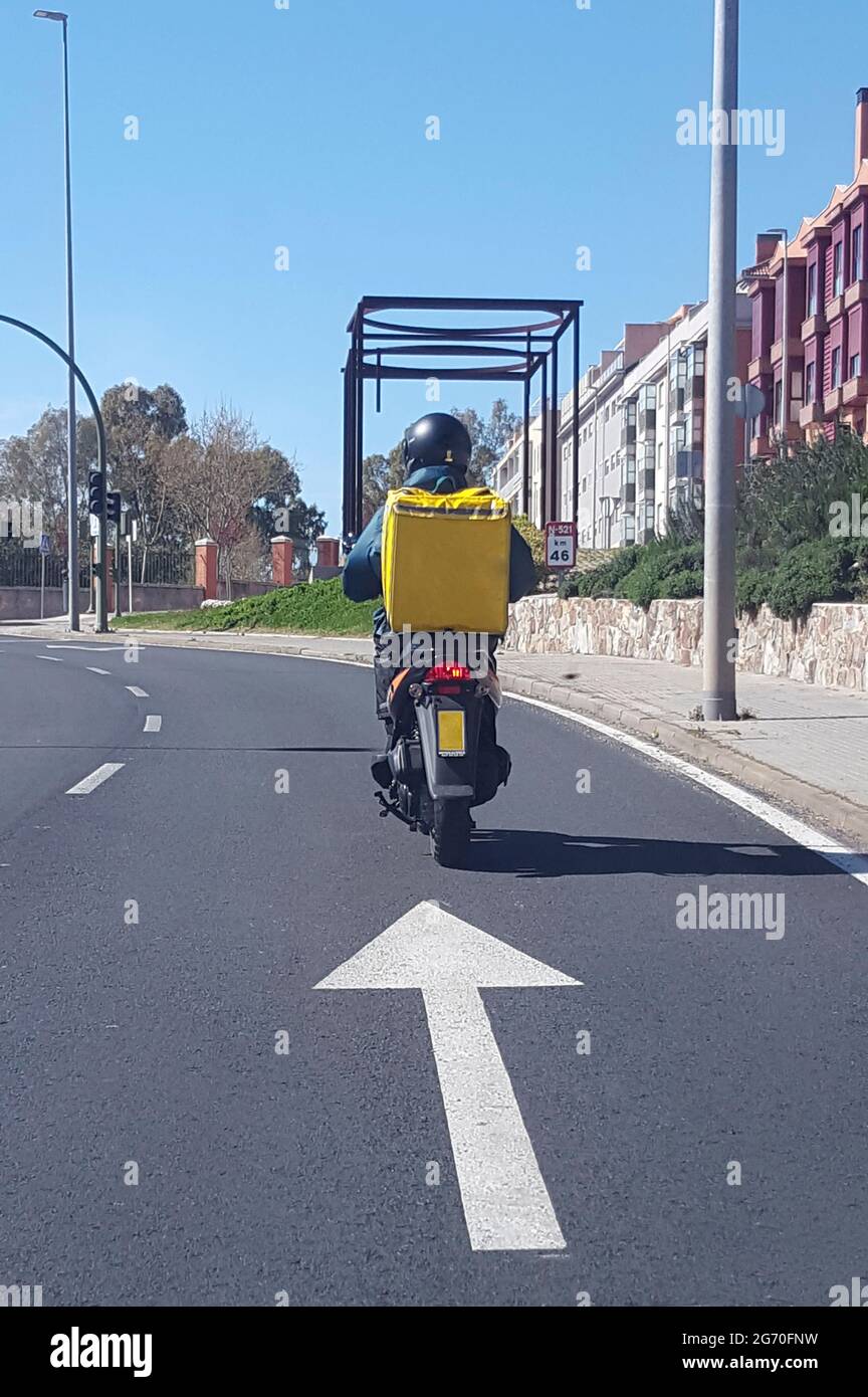 Food delivery motorbiker. Interior car view Stock Photo - Alamy