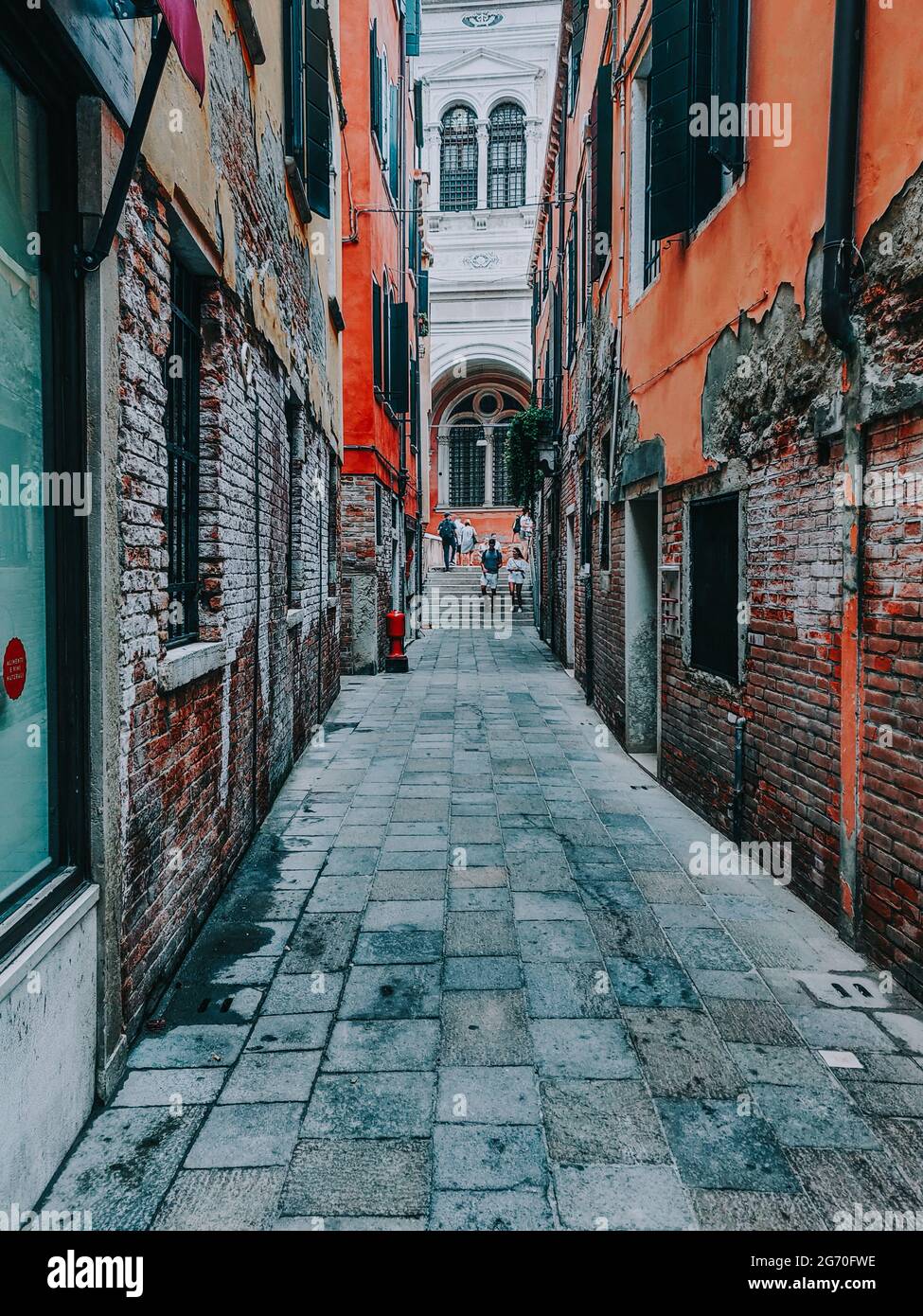 Narrow alley in-between old European buildings in daylight Stock Photo ...