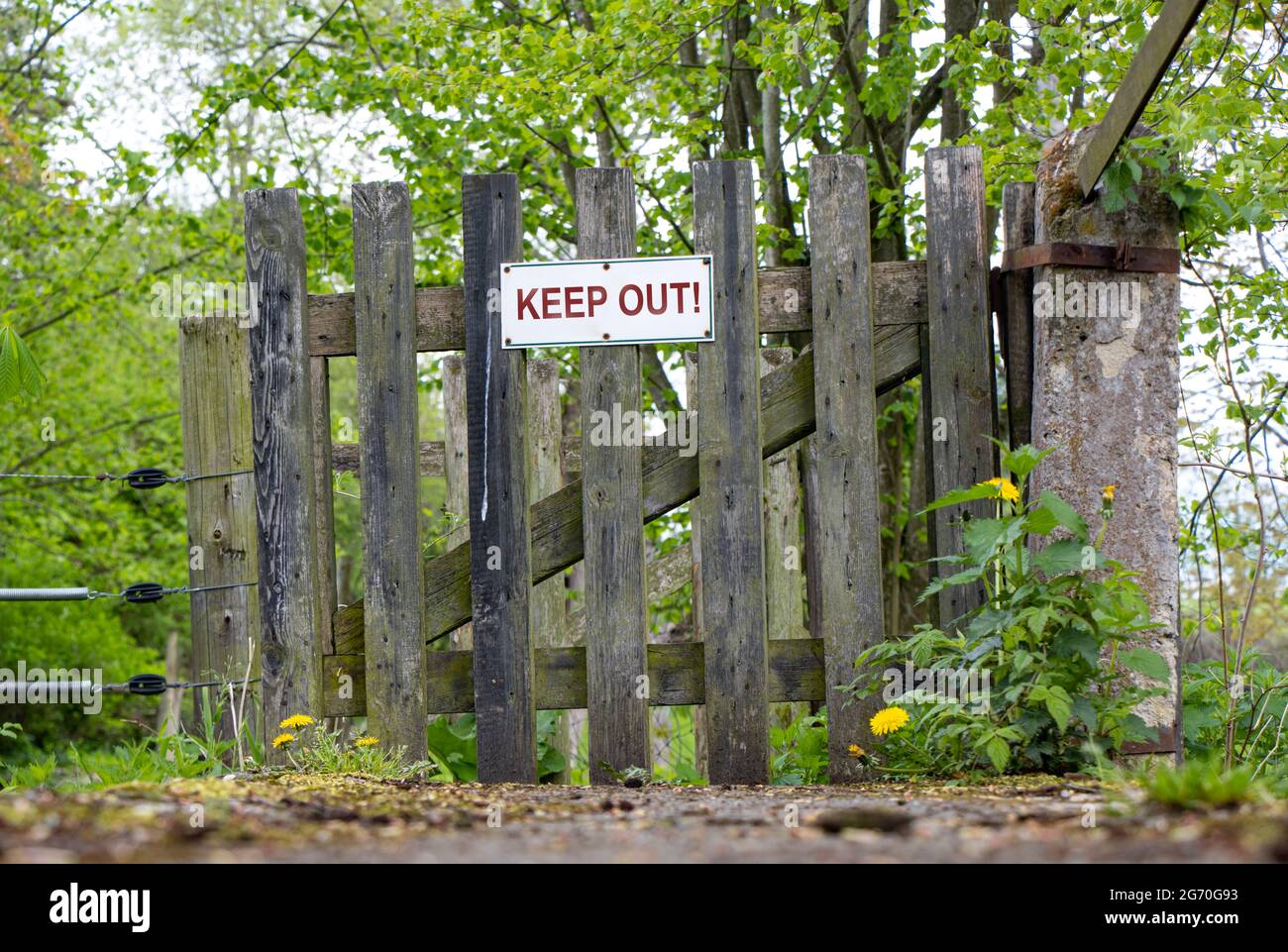 The wooden country gate and fence with sign Keep Out Stock Photo - Alamy