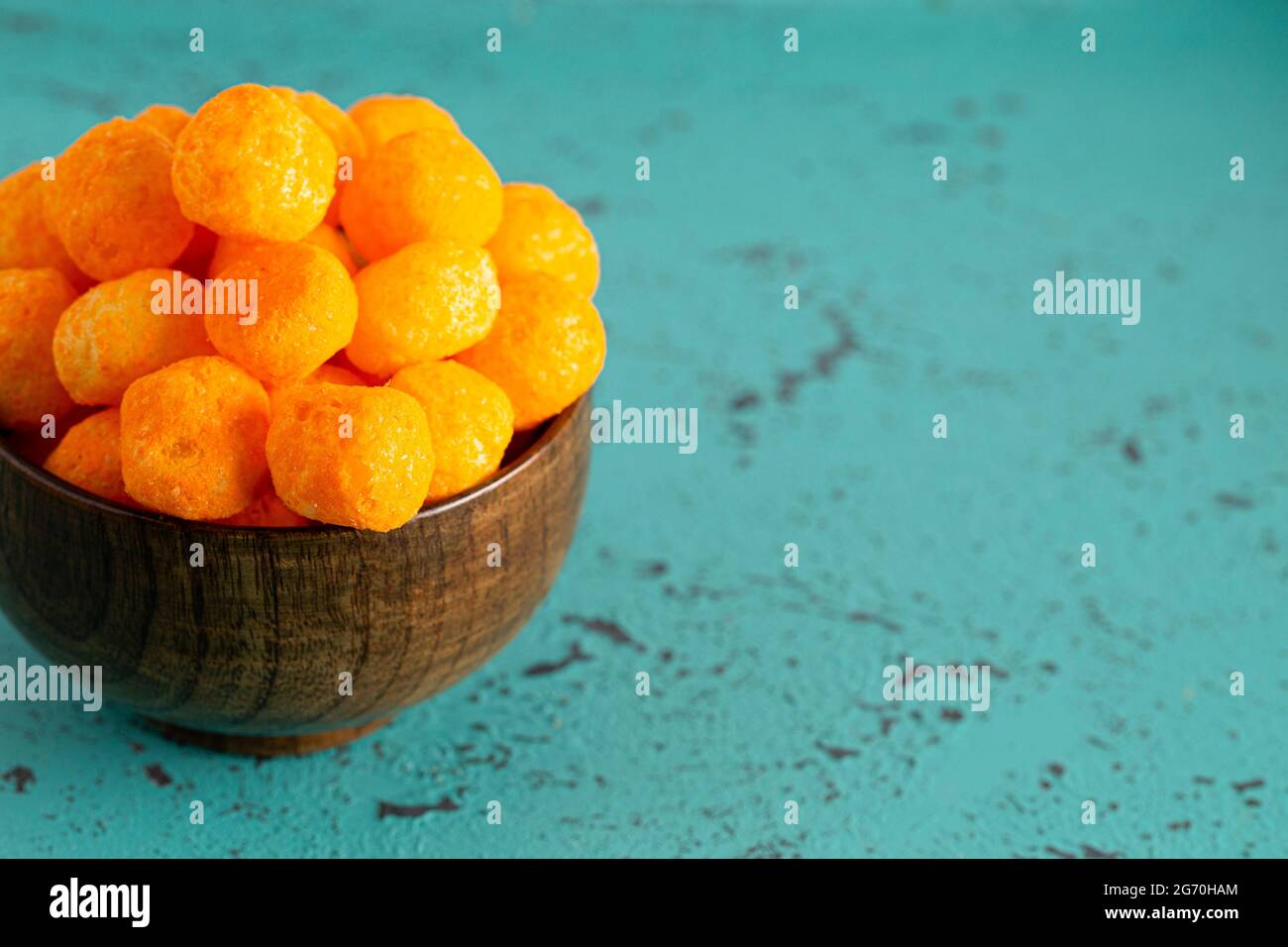 Cheese Covered Ball Snacks on a Teal Table Stock Photo - Alamy