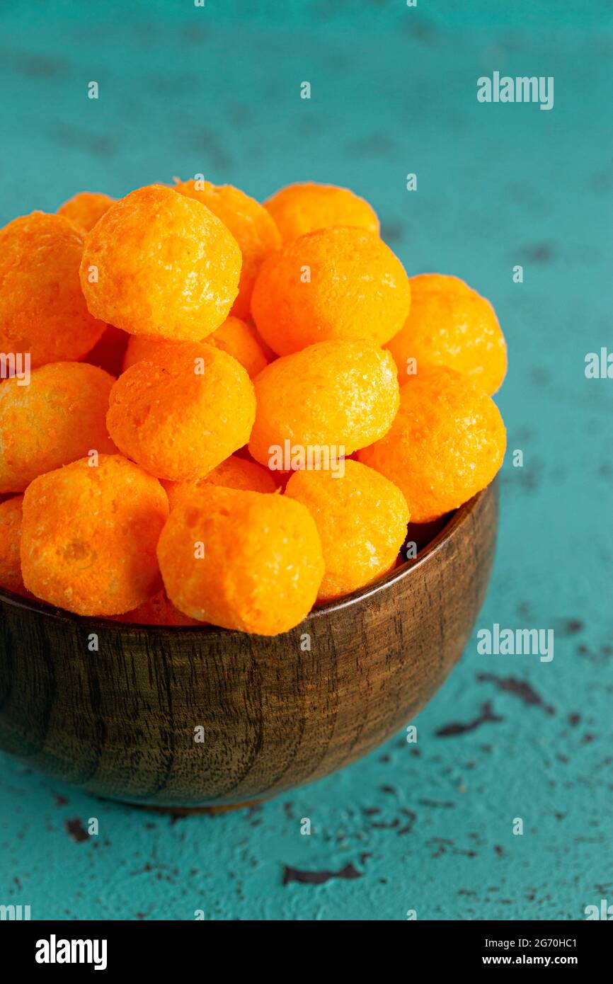 Cheese Covered Ball Snacks on a Teal Table Stock Photo - Alamy
