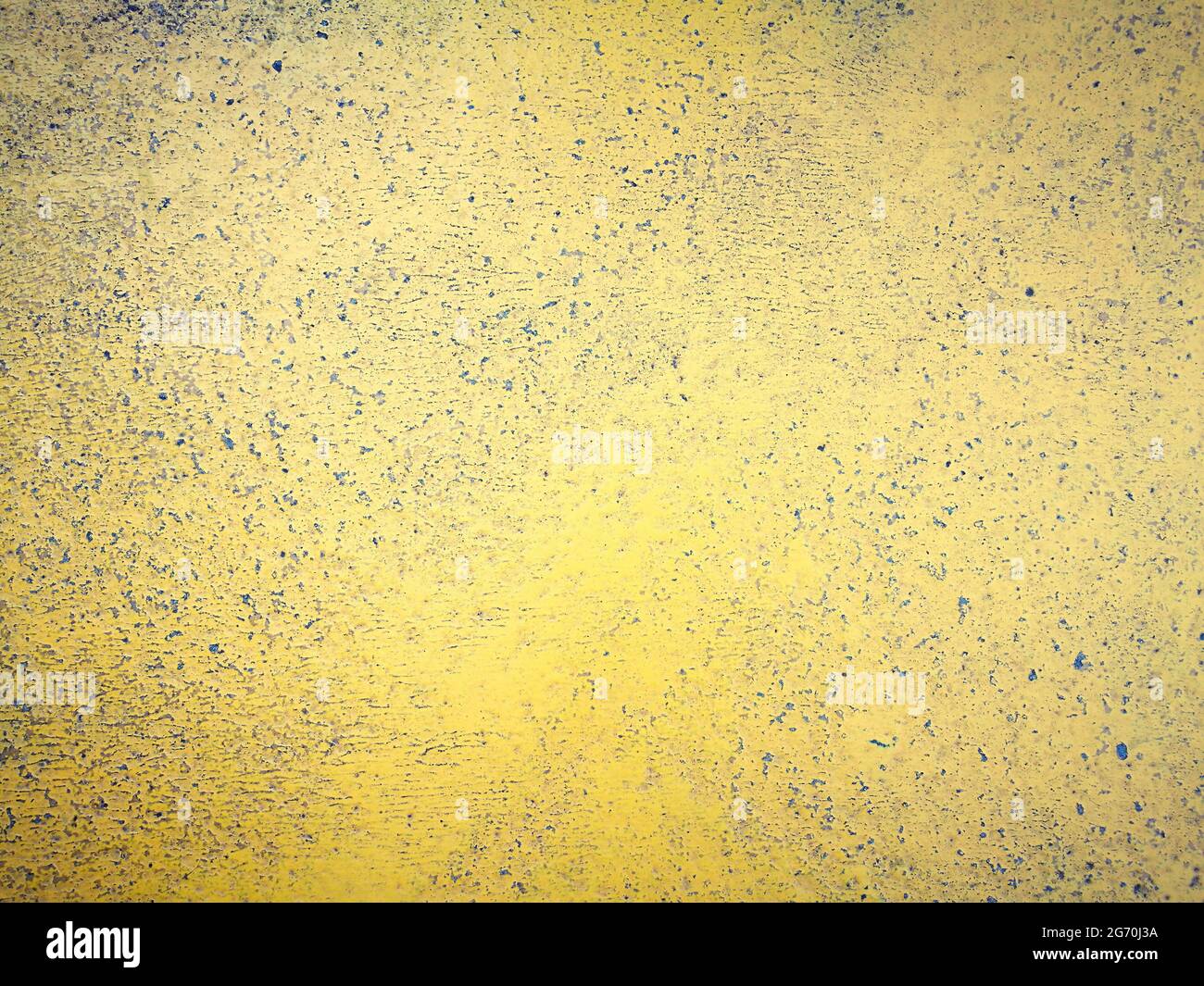Closeup image of a light yellow surface with tiny black dots Stock ...