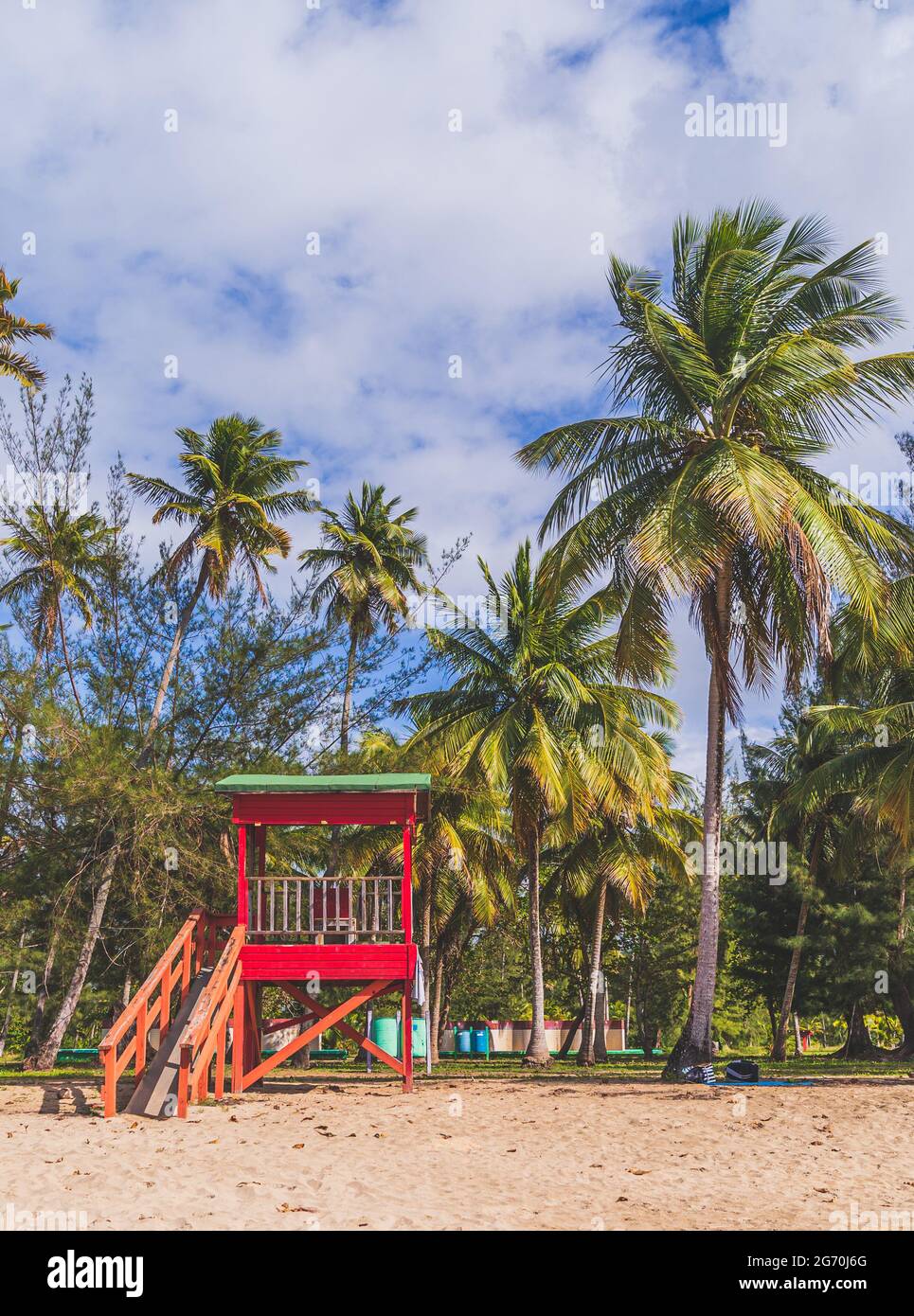 Red Life guard hut and palm trees on tropical beach. Luquillo Beach ...