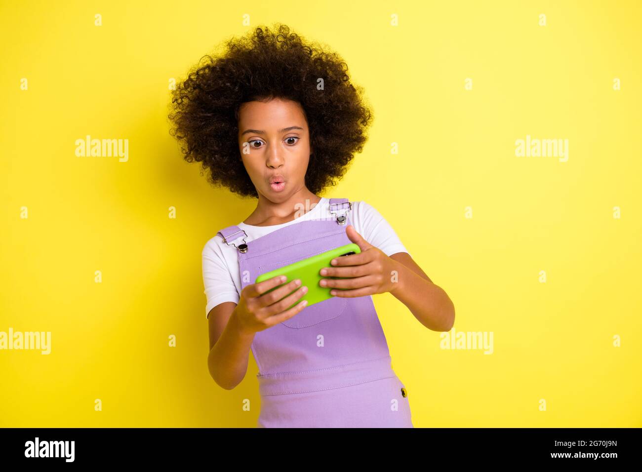 Portrait of pretty addicted wavy-haired girl playing web game app pout ...