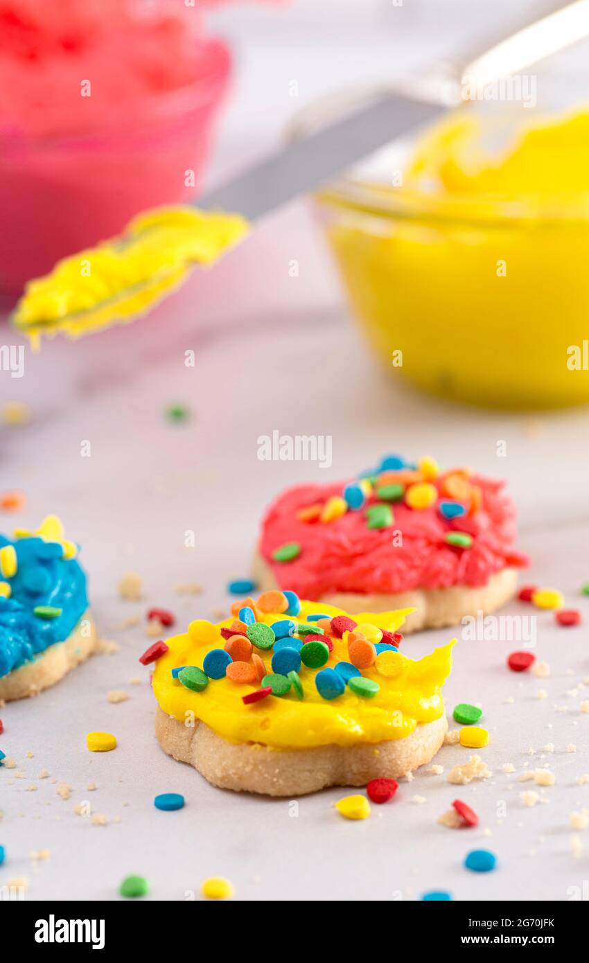 Cookies Decorated with Bright Primary Colored Frosting with Rainbow ...