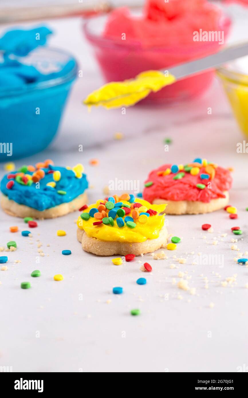 Cookies Decorated with Bright Primary Colored Frosting with Rainbow ...