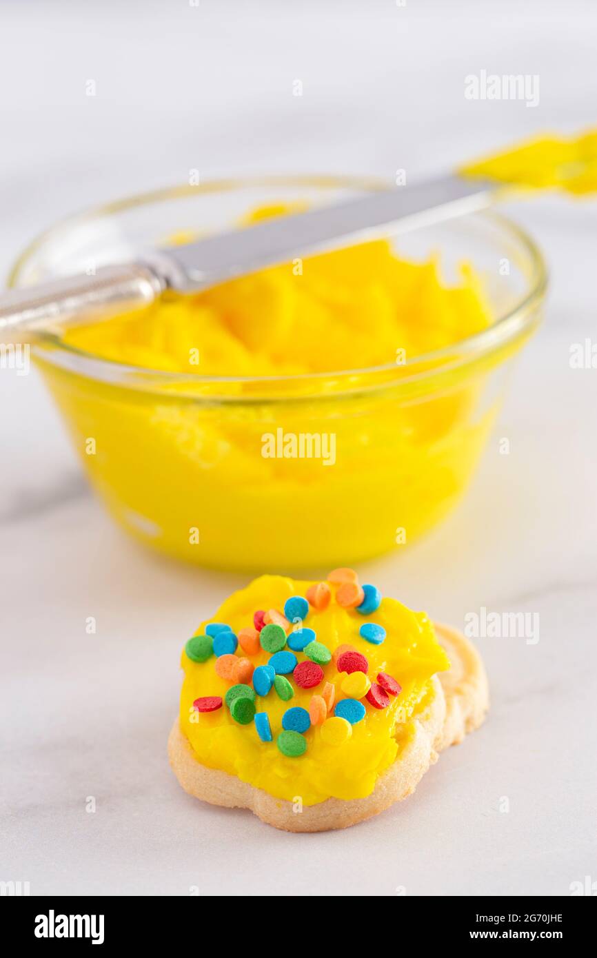 Cookies Decorated with Bright Yellow Colored Frosting with Rainbow ...