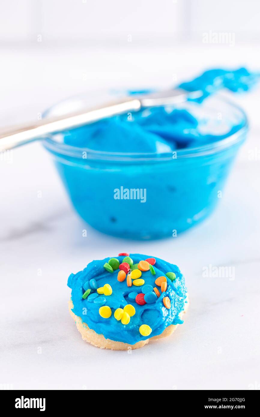 Cookies Decorated with Bright Blue Icing and Rainbow Sprinkles Stock ...