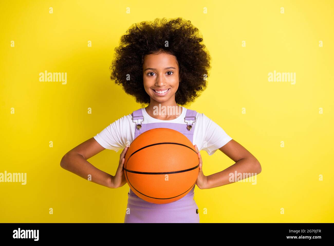 Photo of cheerful small girl hold ball beaming smile wear violet ...