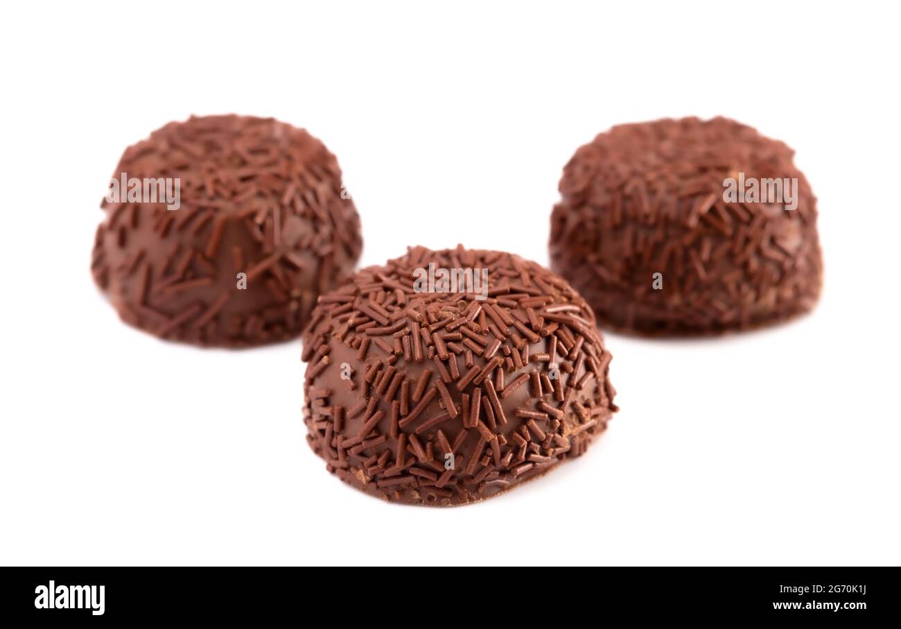 Three Milk Chocolate Truffles in a Row Isolated on a White Background ...