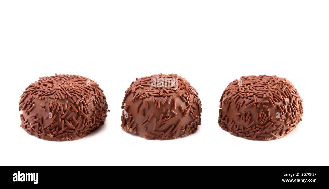 Three Milk Chocolate Truffles in a Row Isolated on a White Background ...