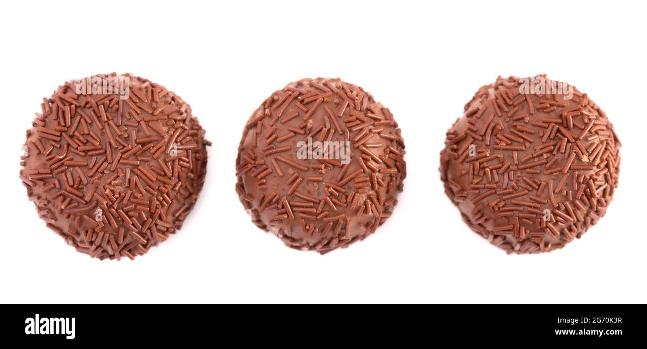 Three Milk Chocolate Truffles in a Row Isolated on a White Background ...