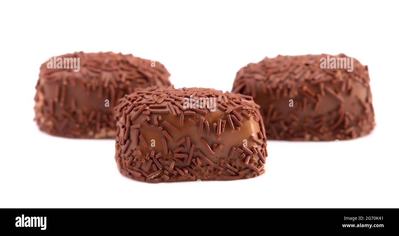 Three Milk Chocolate Truffles in a Row Isolated on a White Background ...