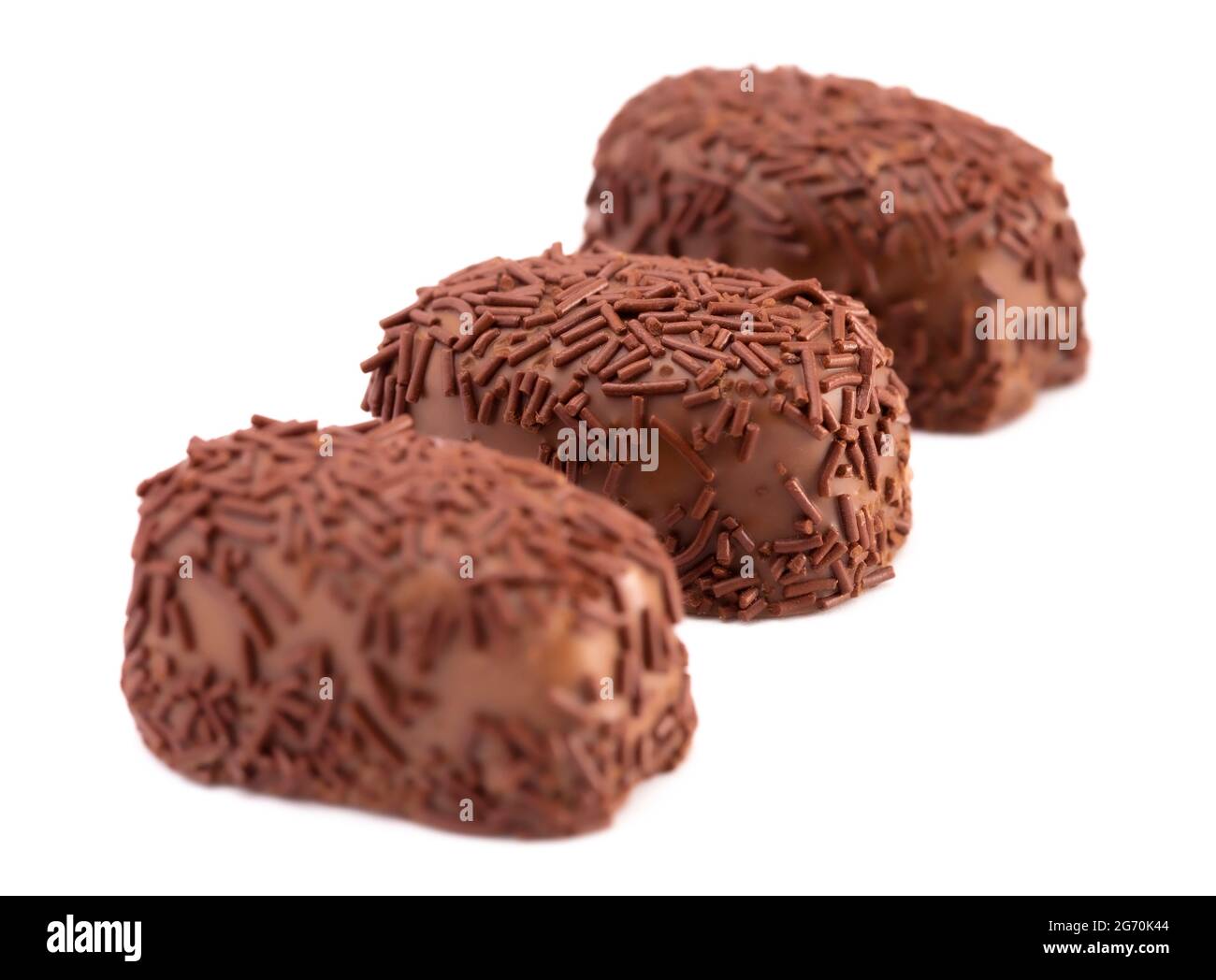 Three Milk Chocolate Truffles in a Row Isolated on a White Background ...