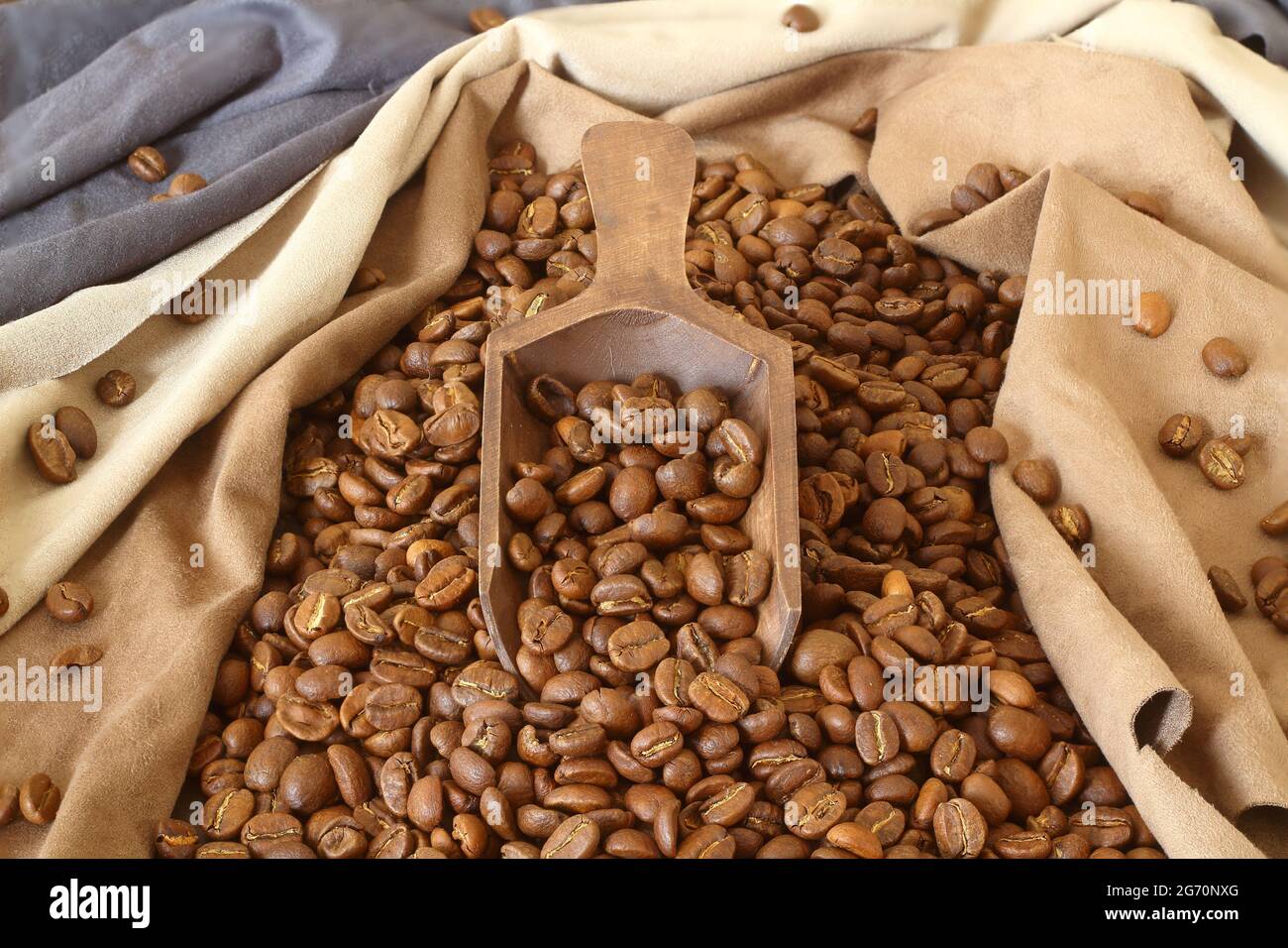 coffee beans in a wooden spoon Stock Photo - Alamy