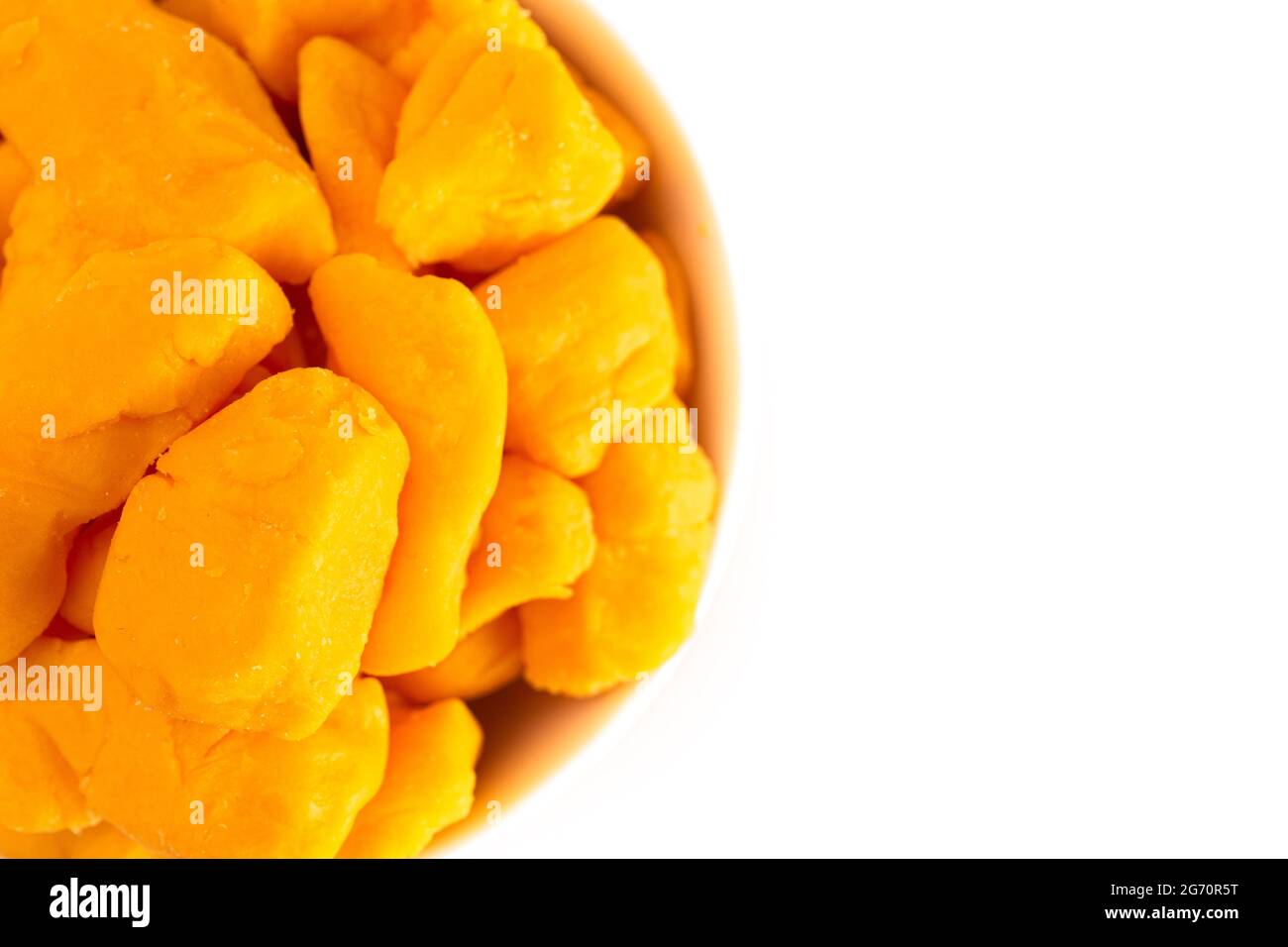 A Bowl of Cheddar Cheese Curds Isolated on a White Background Stock ...