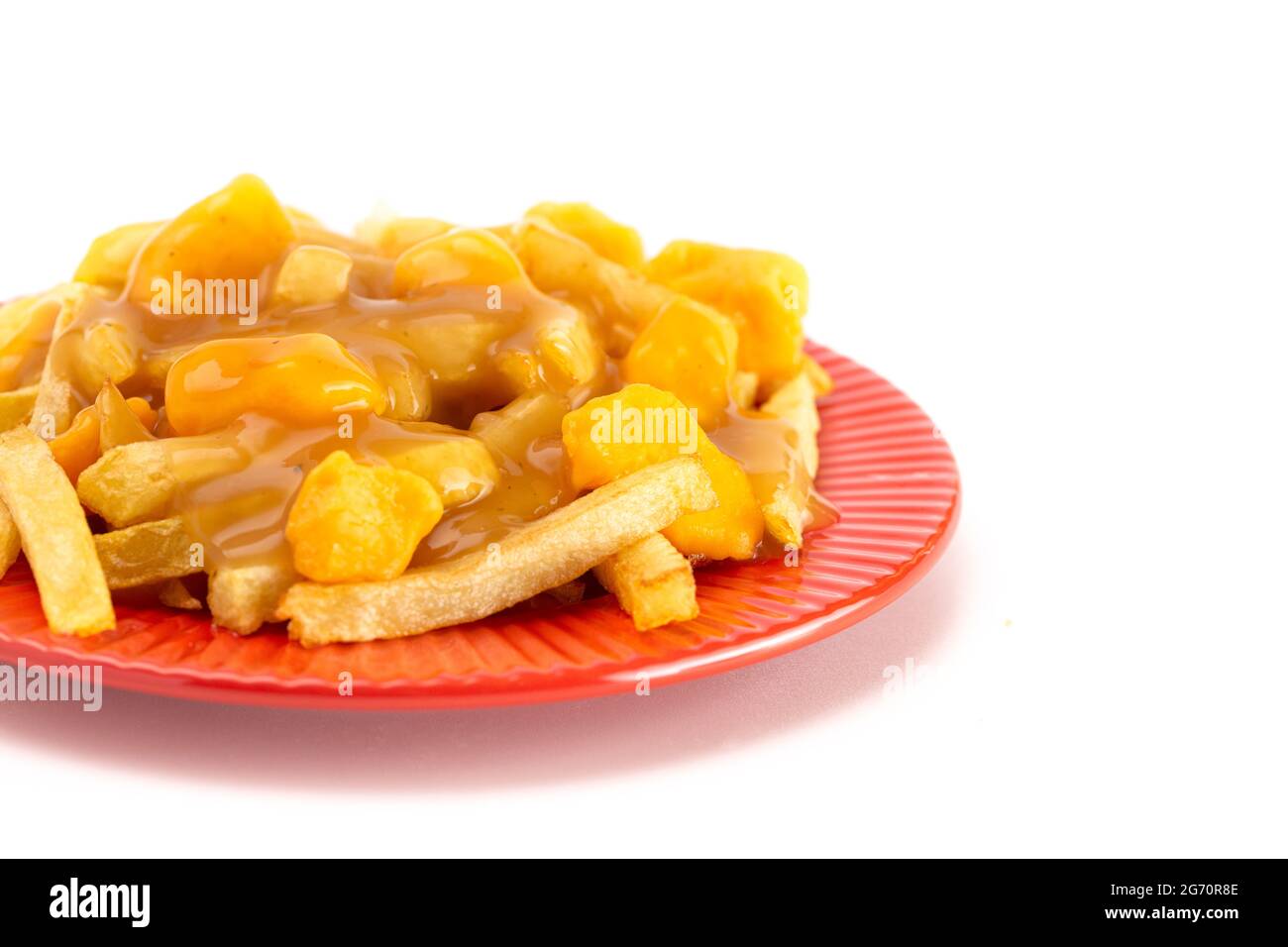 Poutine with Orange Cheddar Cheese with Brown Gravy on French Fries ...