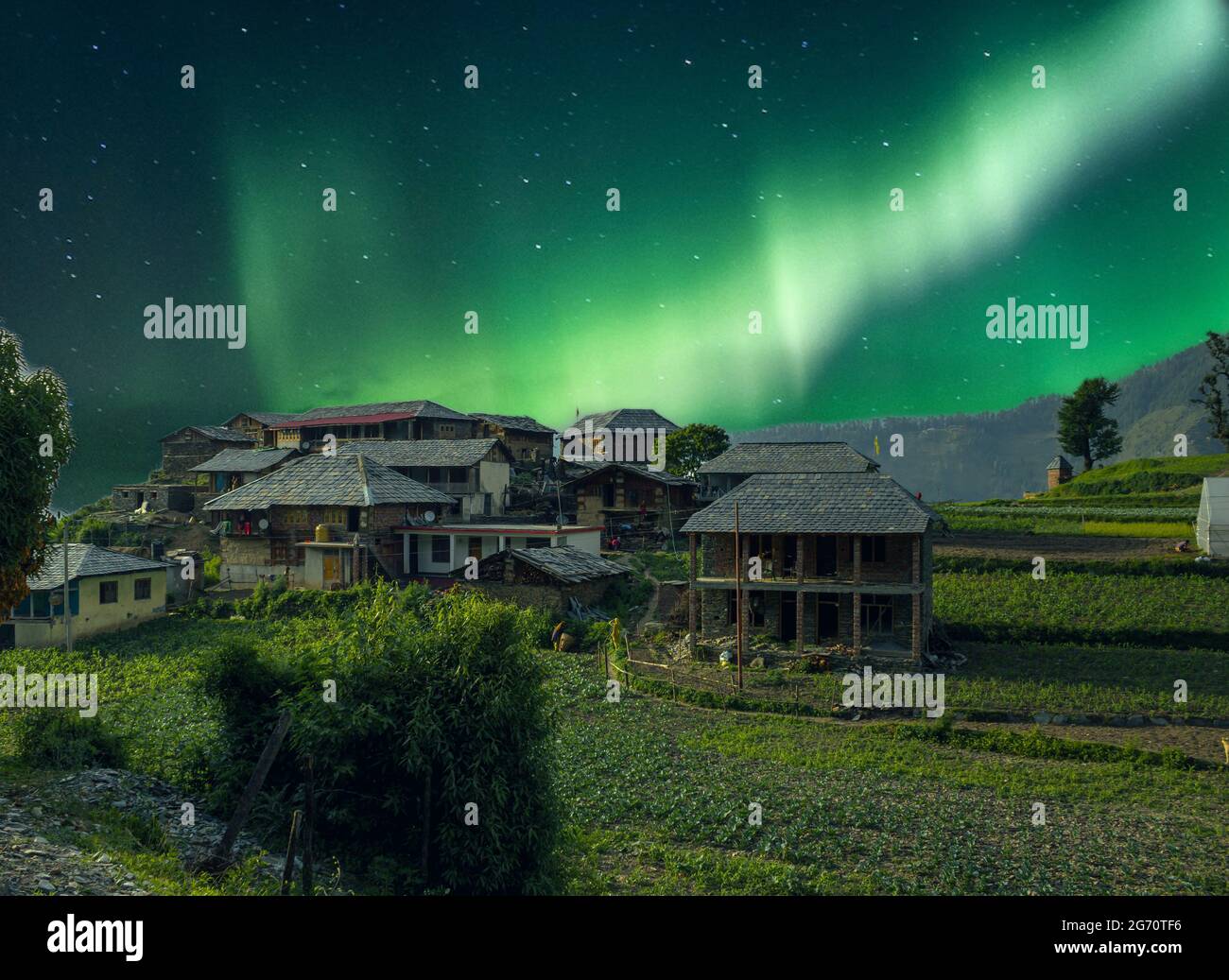 Shot of the buildings during night when visible the northern lights ...