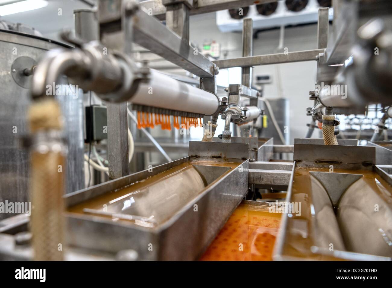 The machine makes artificial red caviar Stock Photo - Alamy