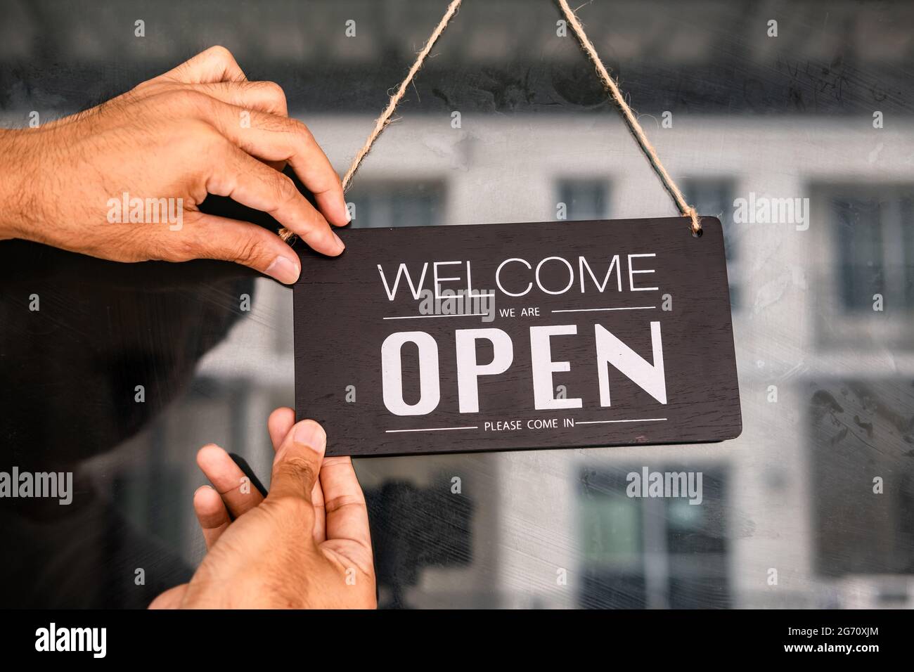 Asians with sign open and closed in restaurant for lockdown ideas ...