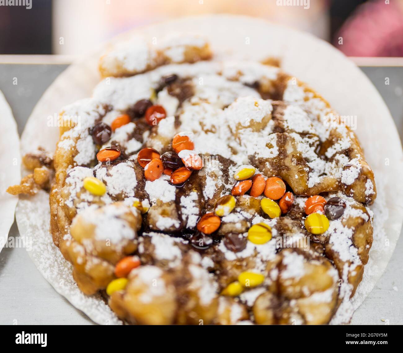 Carnival Funnel Cake Topped with Powdered Sugar, Caramel, and M&Ms ...
