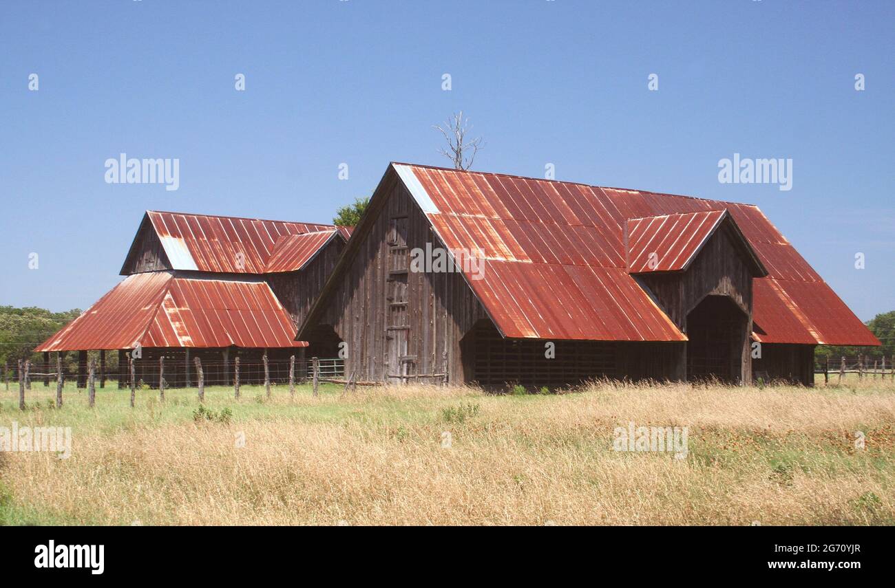 Scenic view of historic barns on a rural farm in East Texas against ...