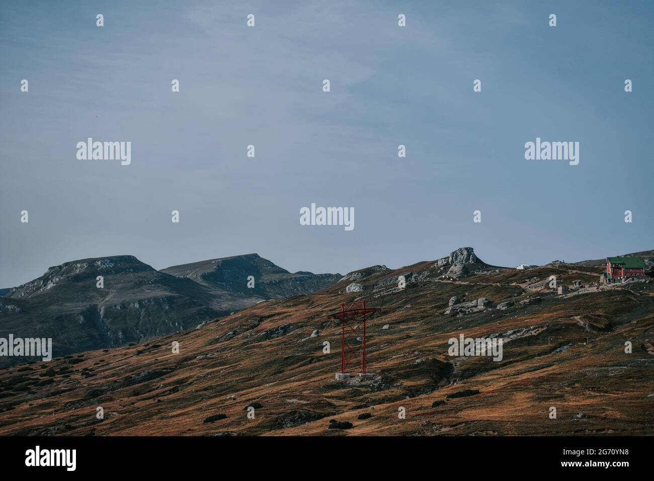 Small rocky mountains against the blue sky Stock Photo - Alamy