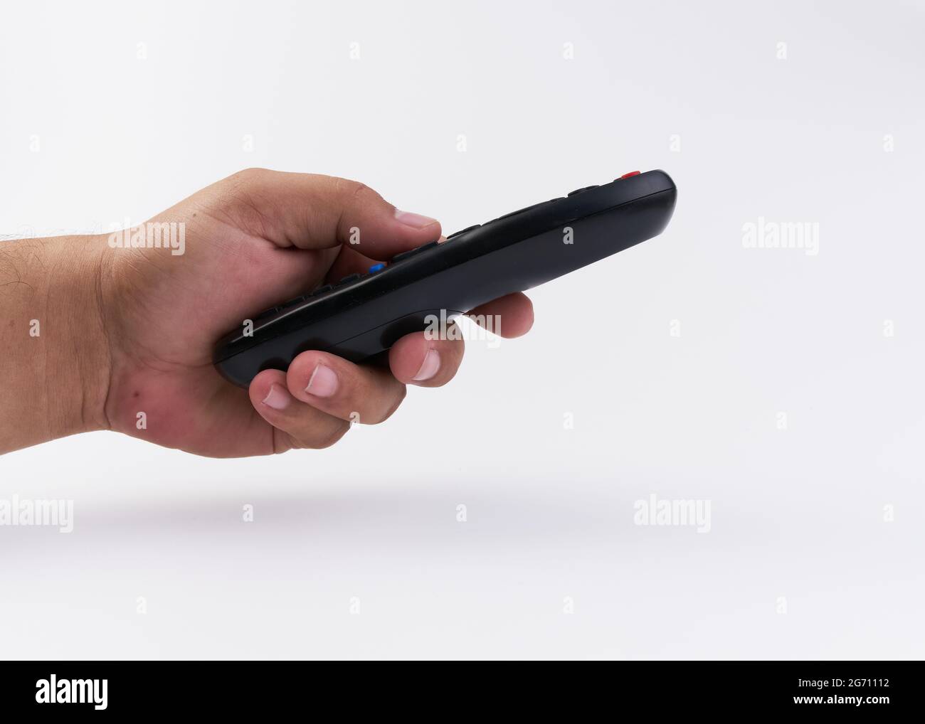 Person holding a remote controller isolated on a white background Stock ...