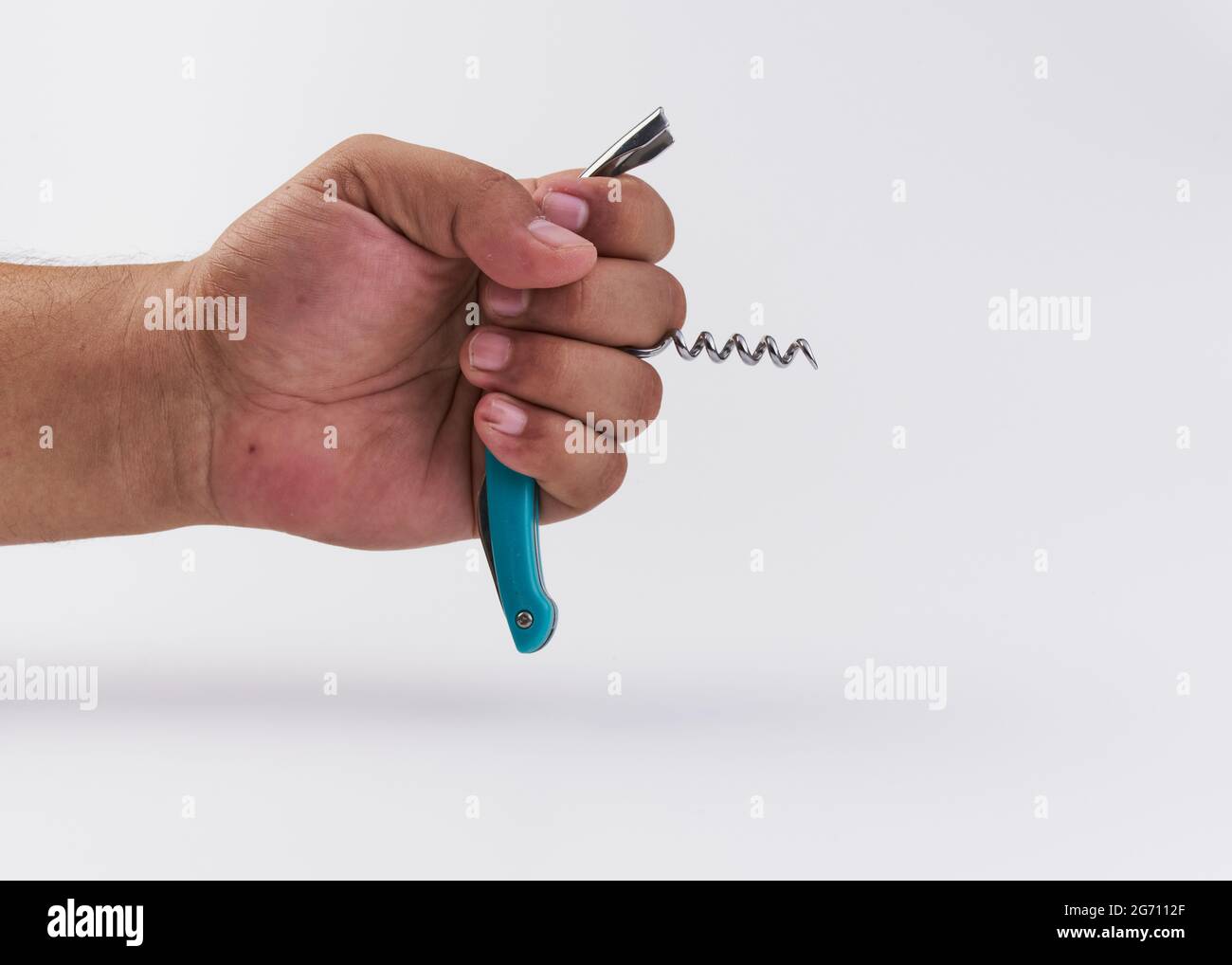 Person holding a corkscrew isolated on a white background Stock Photo ...