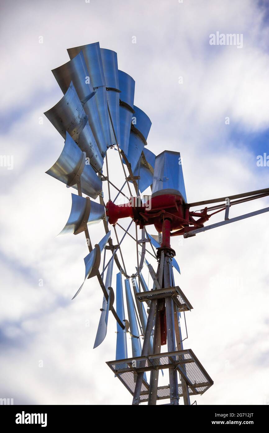 Vertical shot of a windmill against the cloudy sky Stock Photo - Alamy