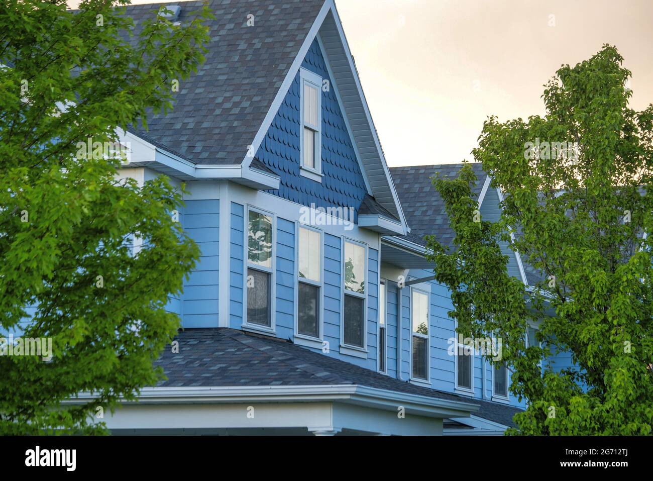 House surrounded by trees Stock Photo - Alamy