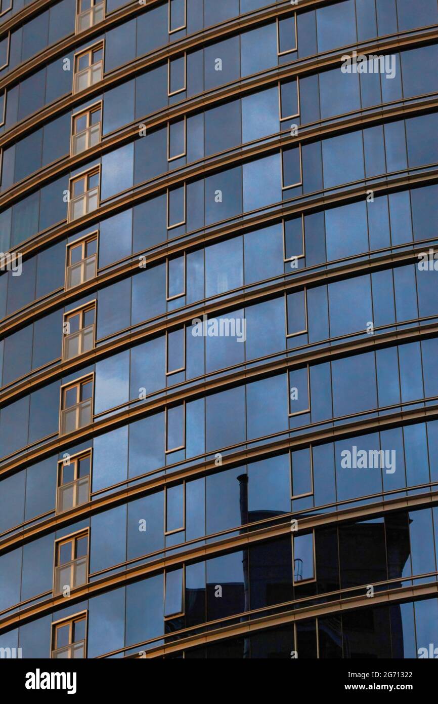 Vertical view of windows of a high rise office building with ...