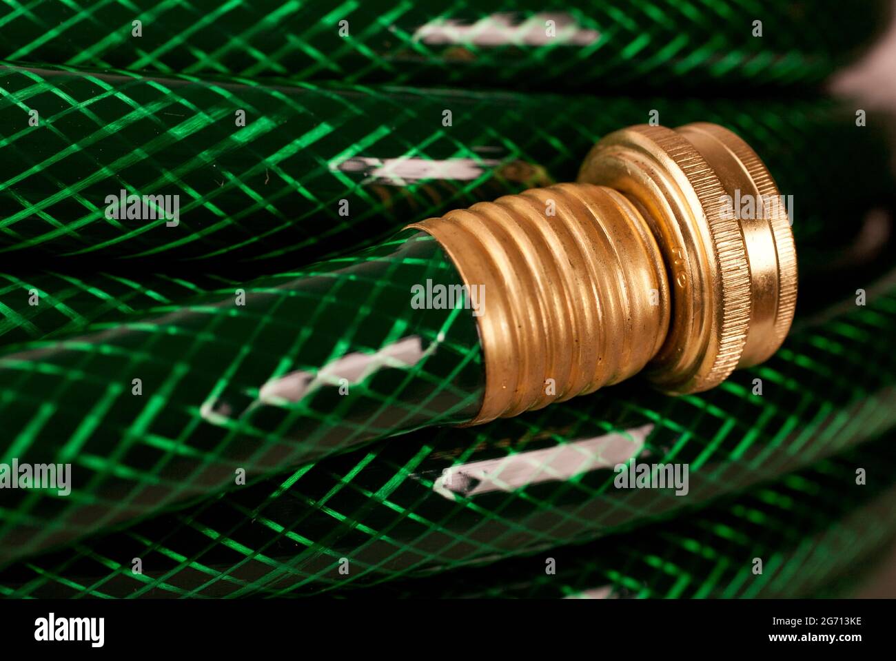 Close up green garden hose Stock Photo - Alamy