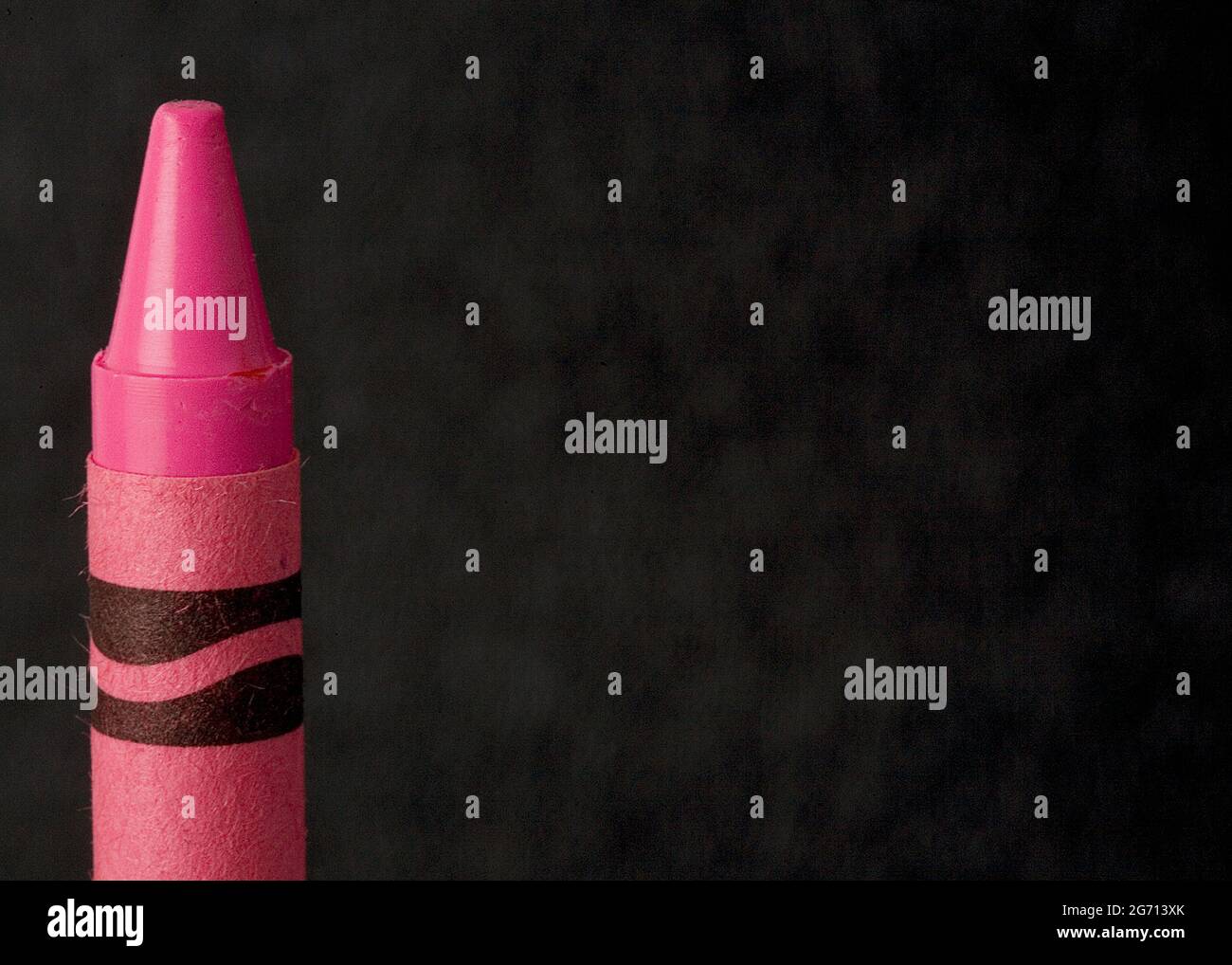 Pink crayon black background Stock Photo - Alamy