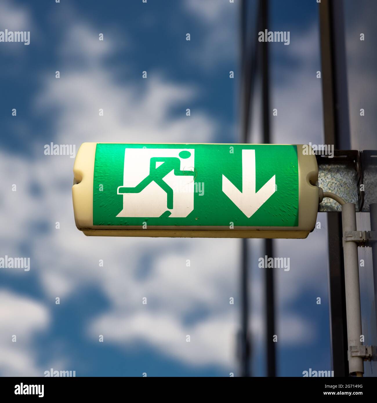 Close up green sign of exit in a public place Stock Photo - Alamy