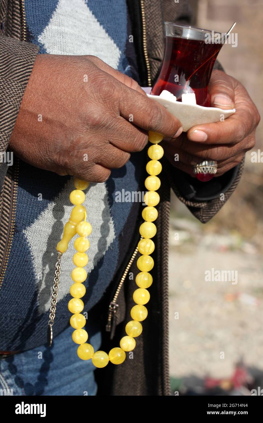 Turkish man Turkish tea, rosary and ring Stock Photo - Alamy