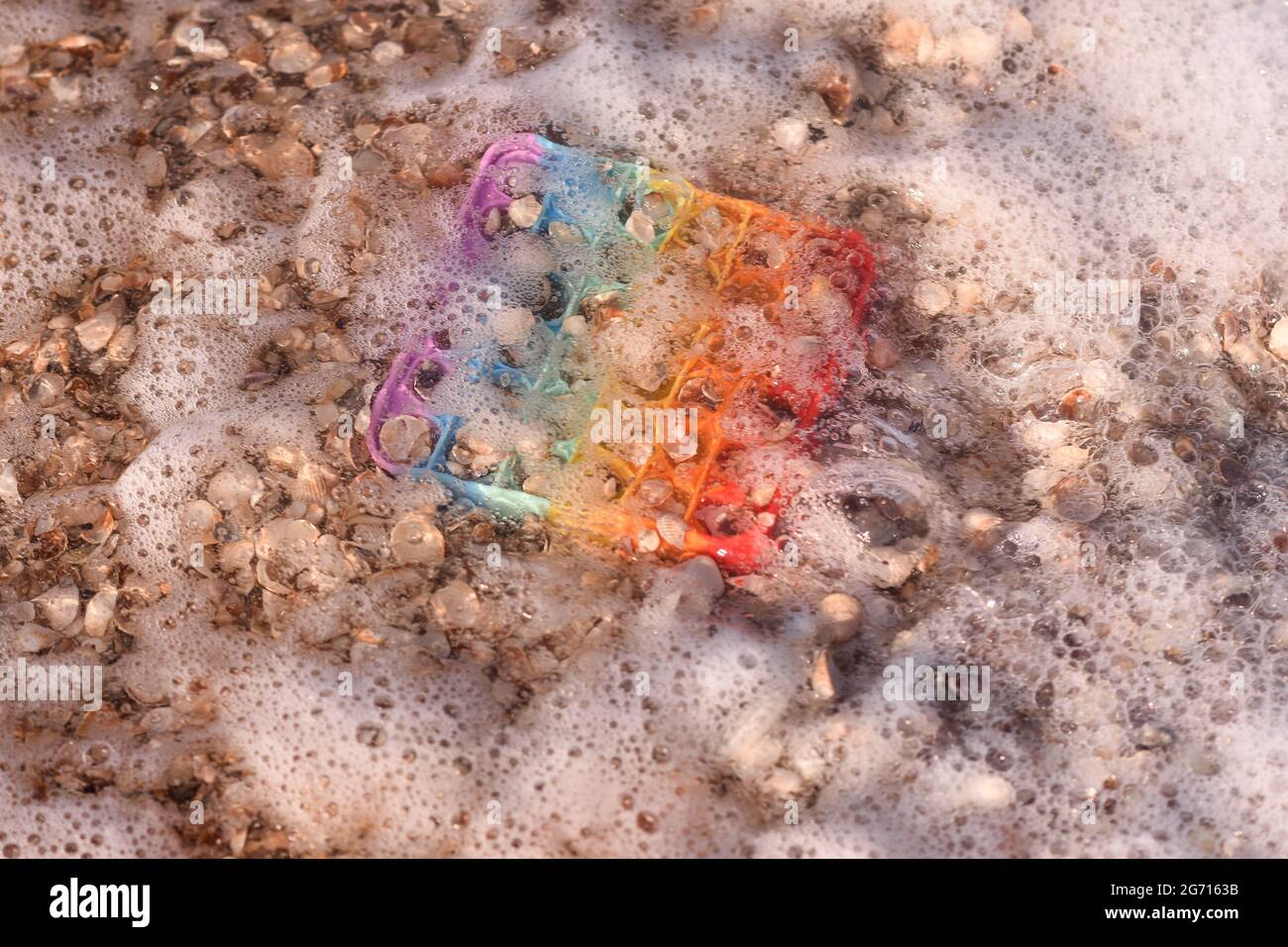 sea water and foam covered the Pop it toy Stock Photo - Alamy