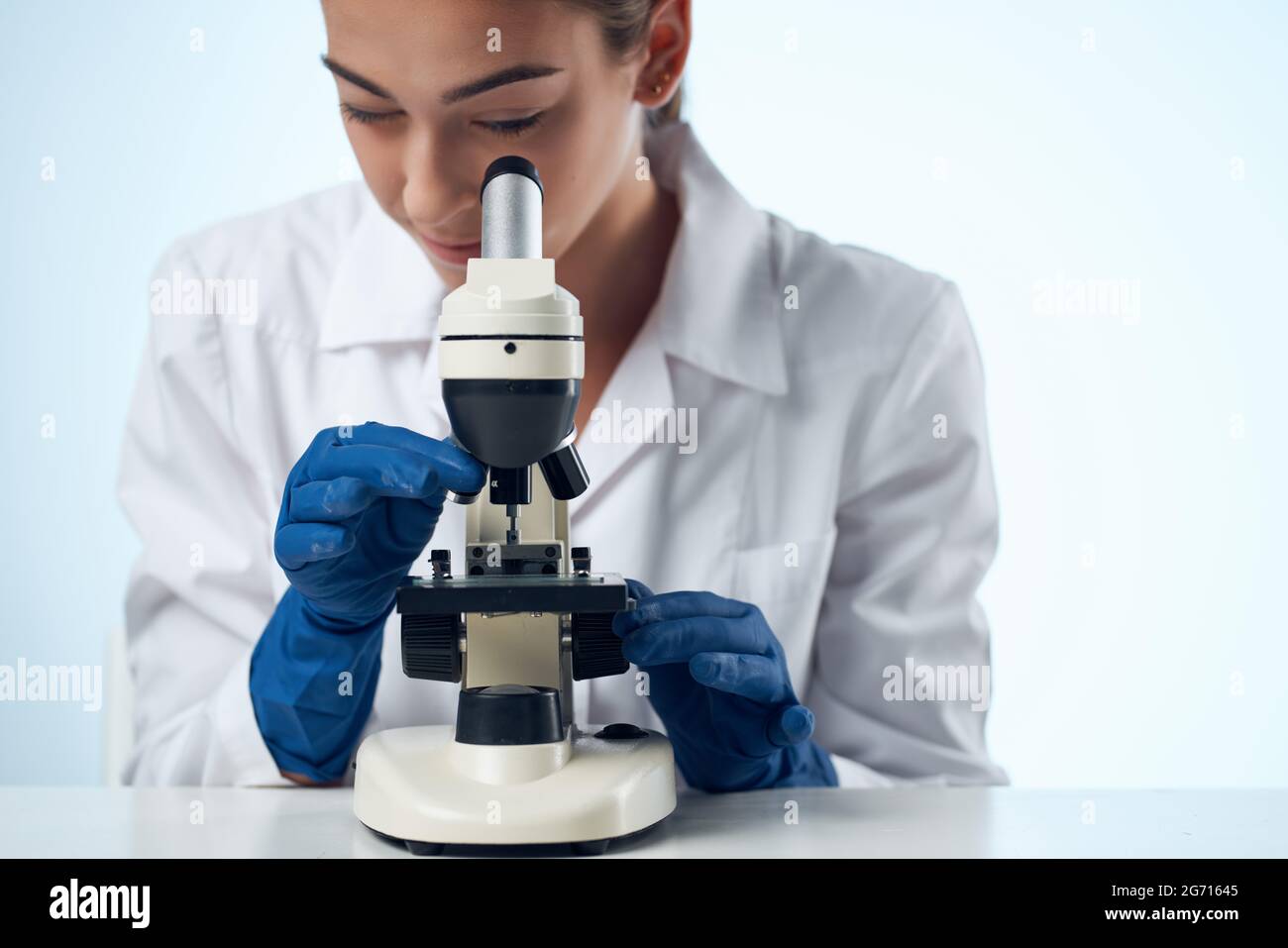 female doctor biology research technology laboratory microscope Stock ...