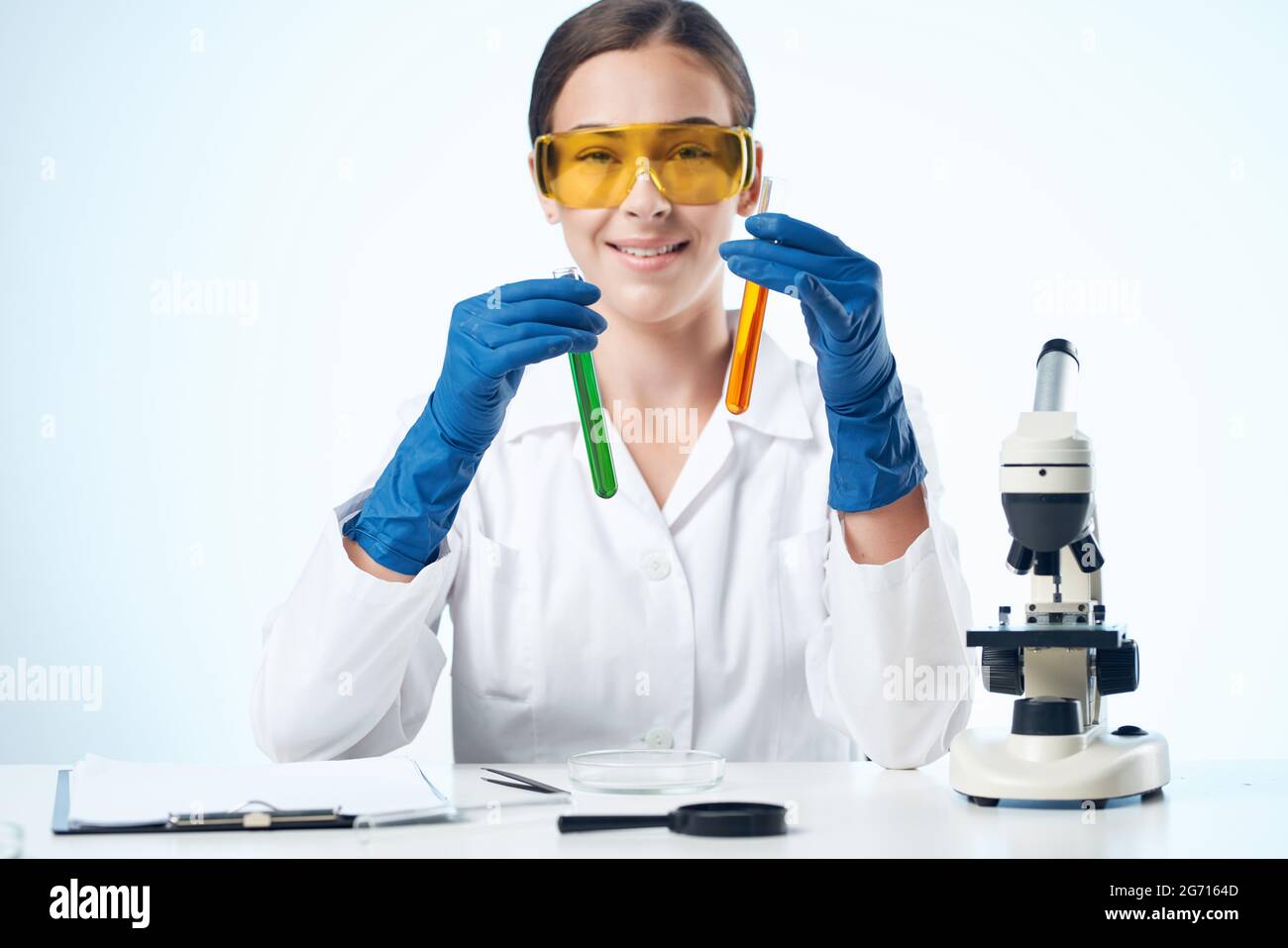 female laboratory assistant desktop chemical solution science ...