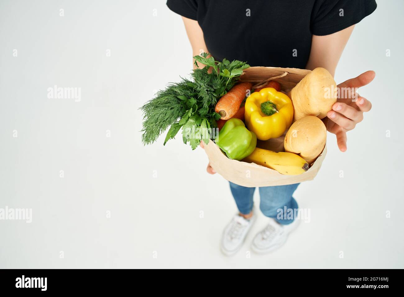 food bag in hand vegetables healthy food delivery Stock Photo - Alamy
