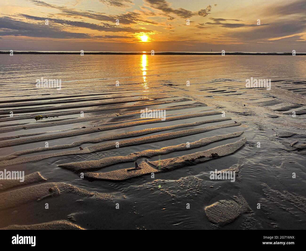 Mesmerizing scenery of a sea at sunset Stock Photo - Alamy