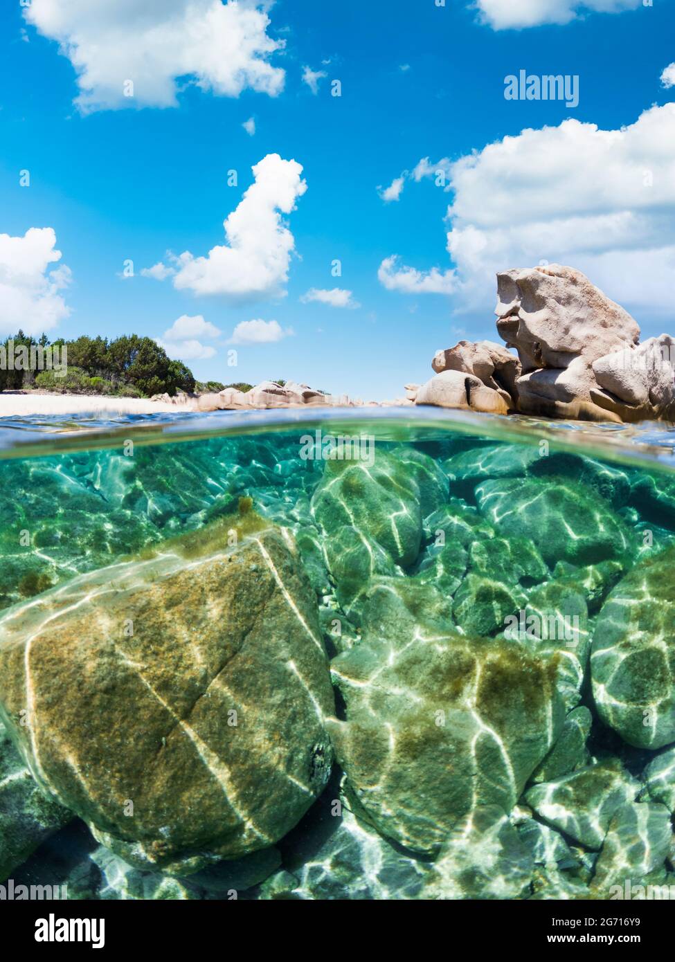 Split-shot, over-under shot. Half underwater half sky with an emerald ...